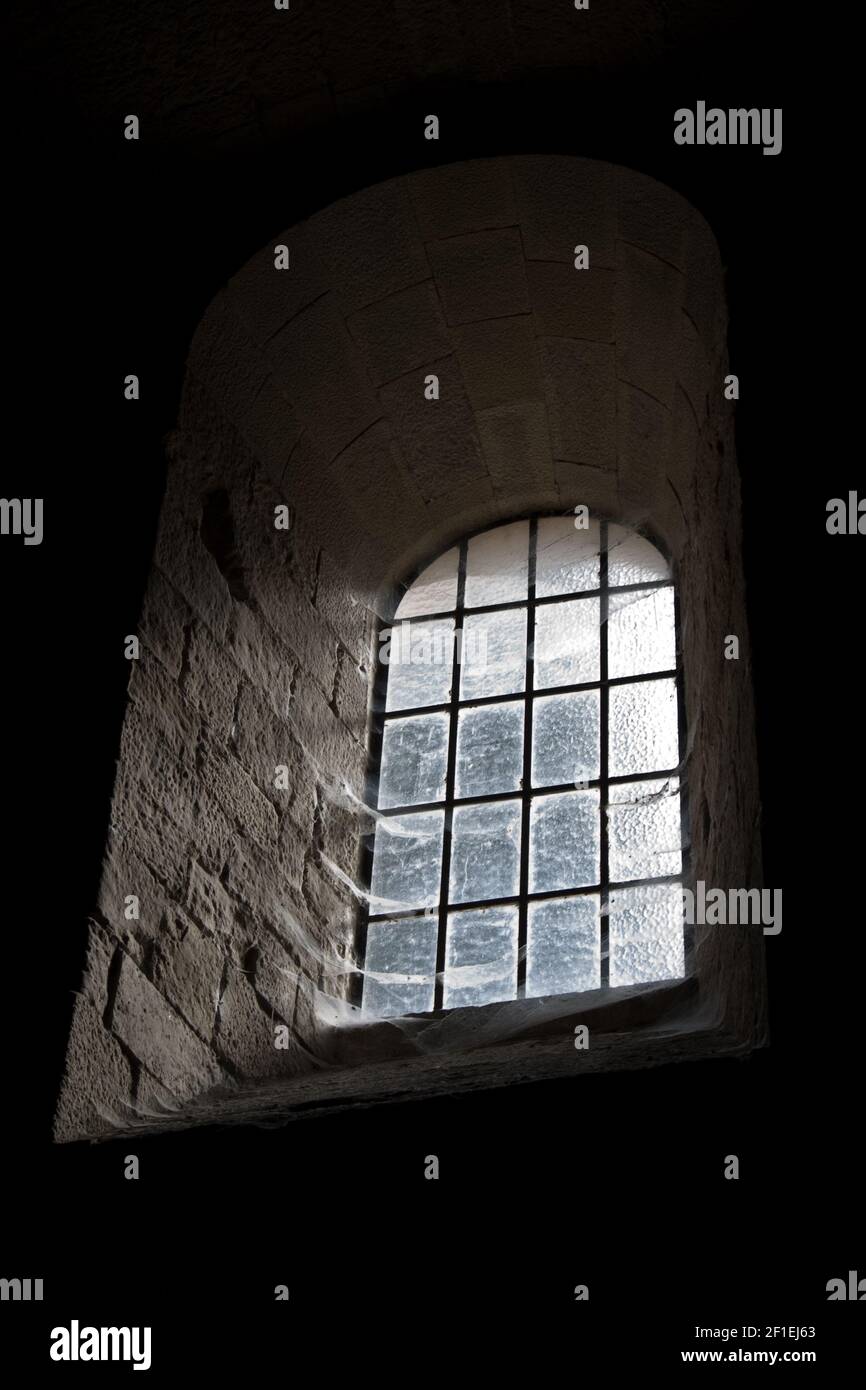 Old castle window in darkness Stock Photo - Alamy