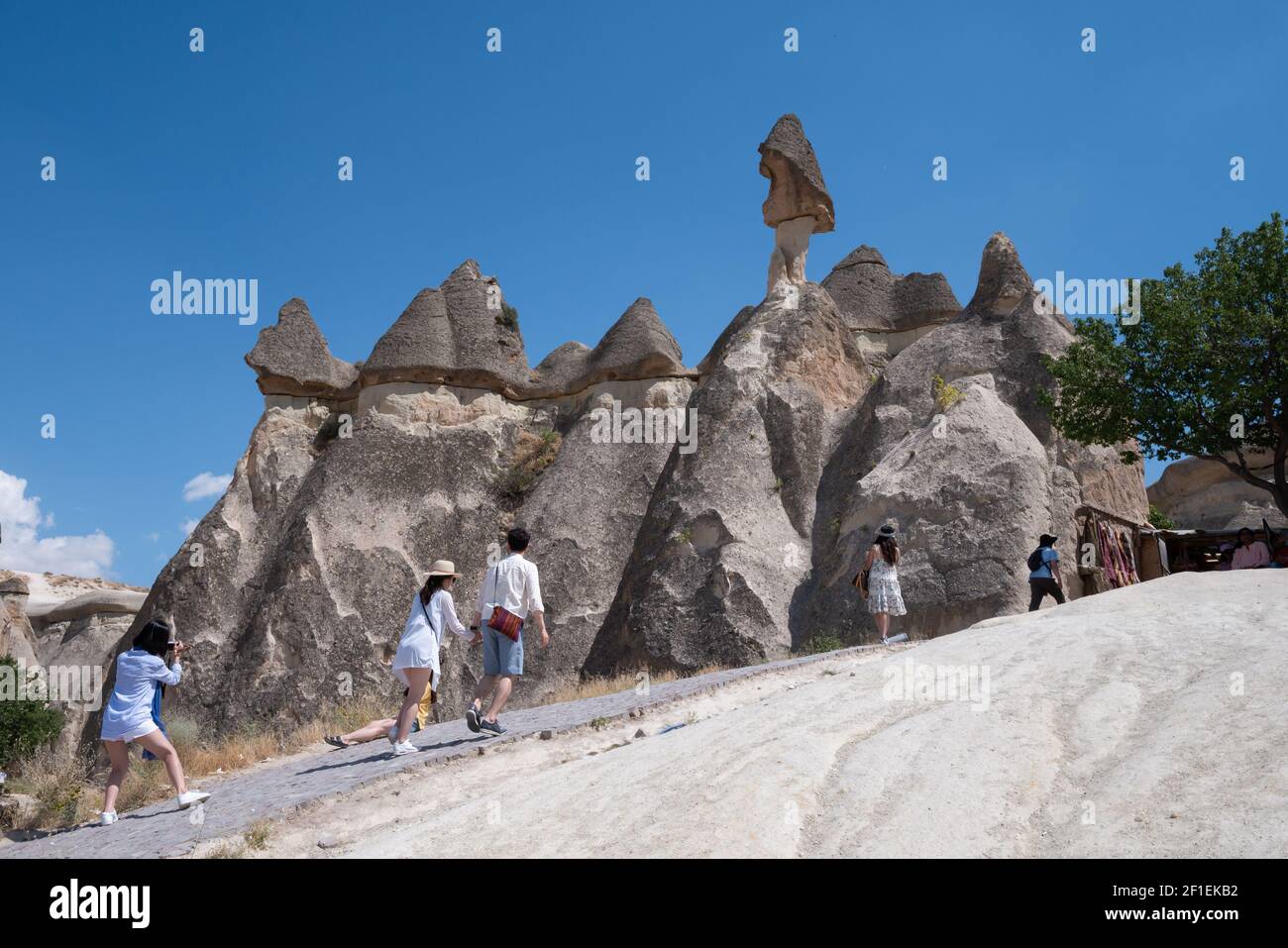 Cappadocia, Turkey - July 16 2018: Asian tourists visiting the Fairy ...