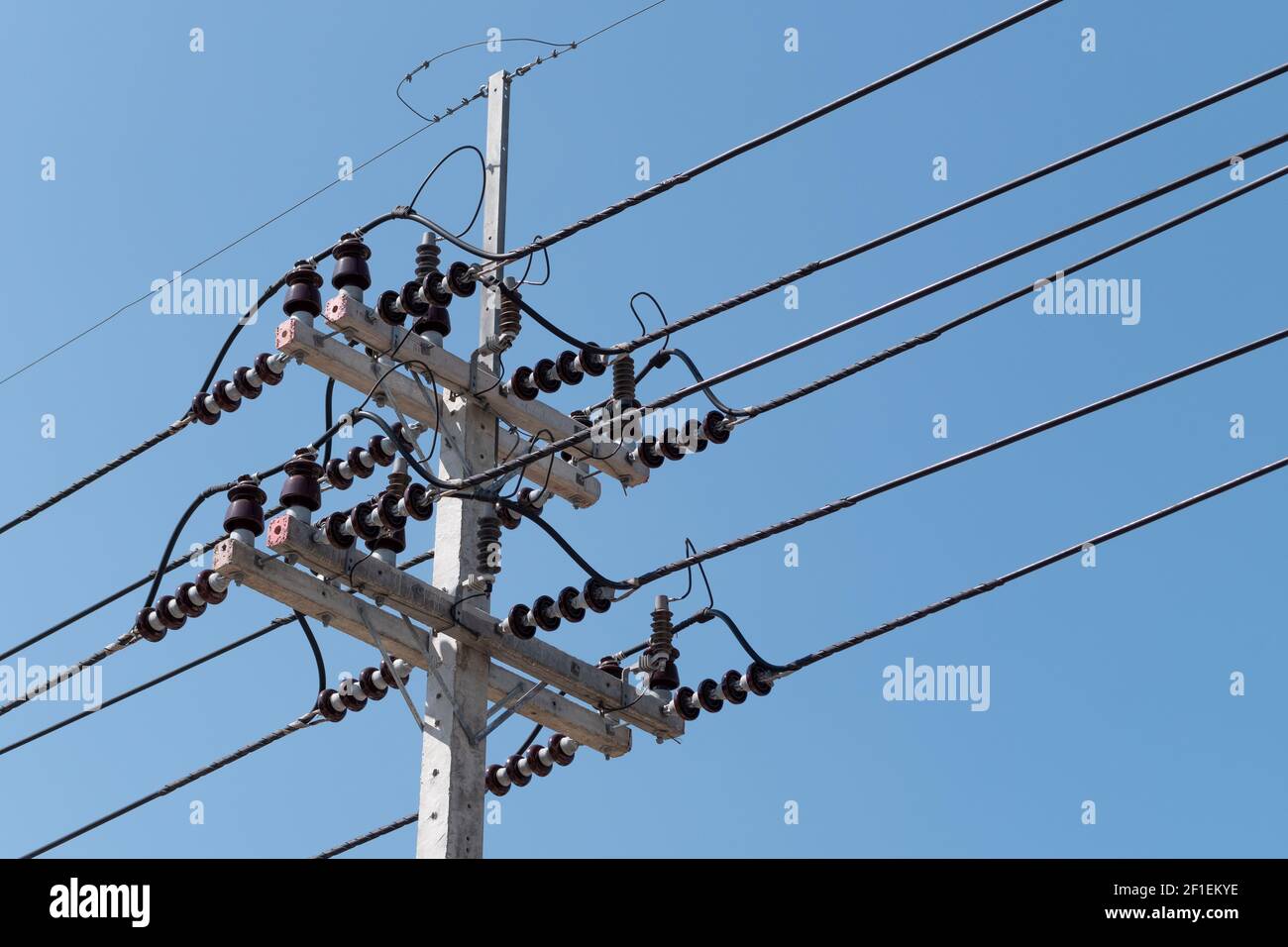 Utility pole with blue sky background Stock Photo - Alamy