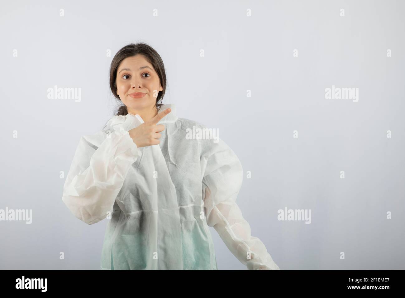 Portrait of young female doctor scientist in defensive lab coat ...