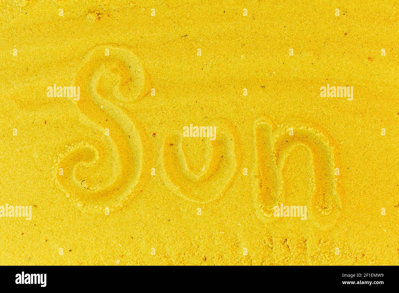 The word sun is written on a yellow beach sand background. Sign or ...