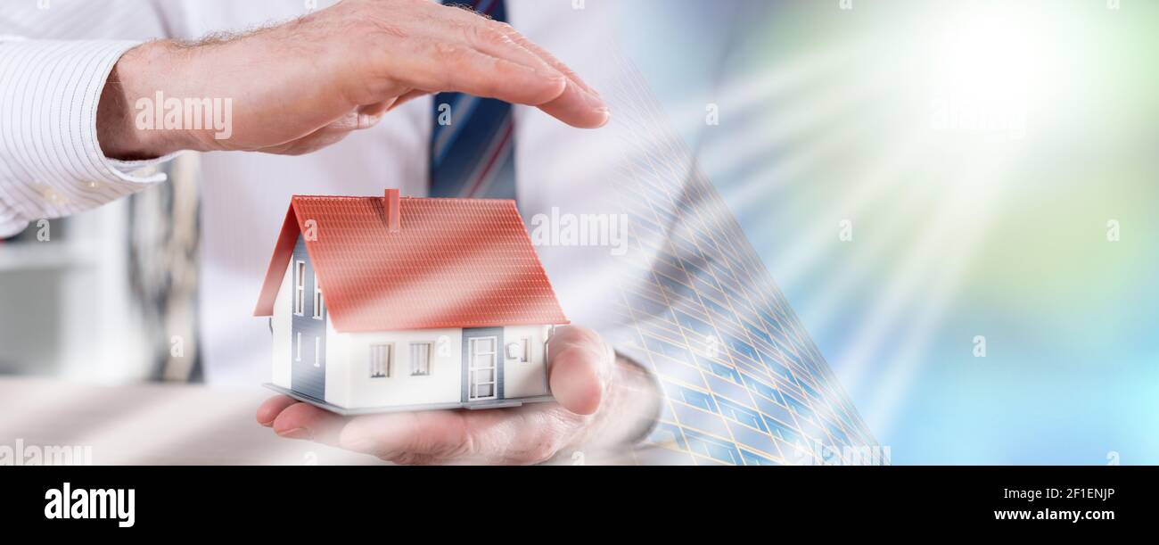 Insurance agent protecting house with his hands; multiple exposure ...