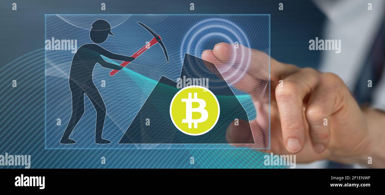 Man touching a bitcoin mining concept on a touch screen with his finger ...
