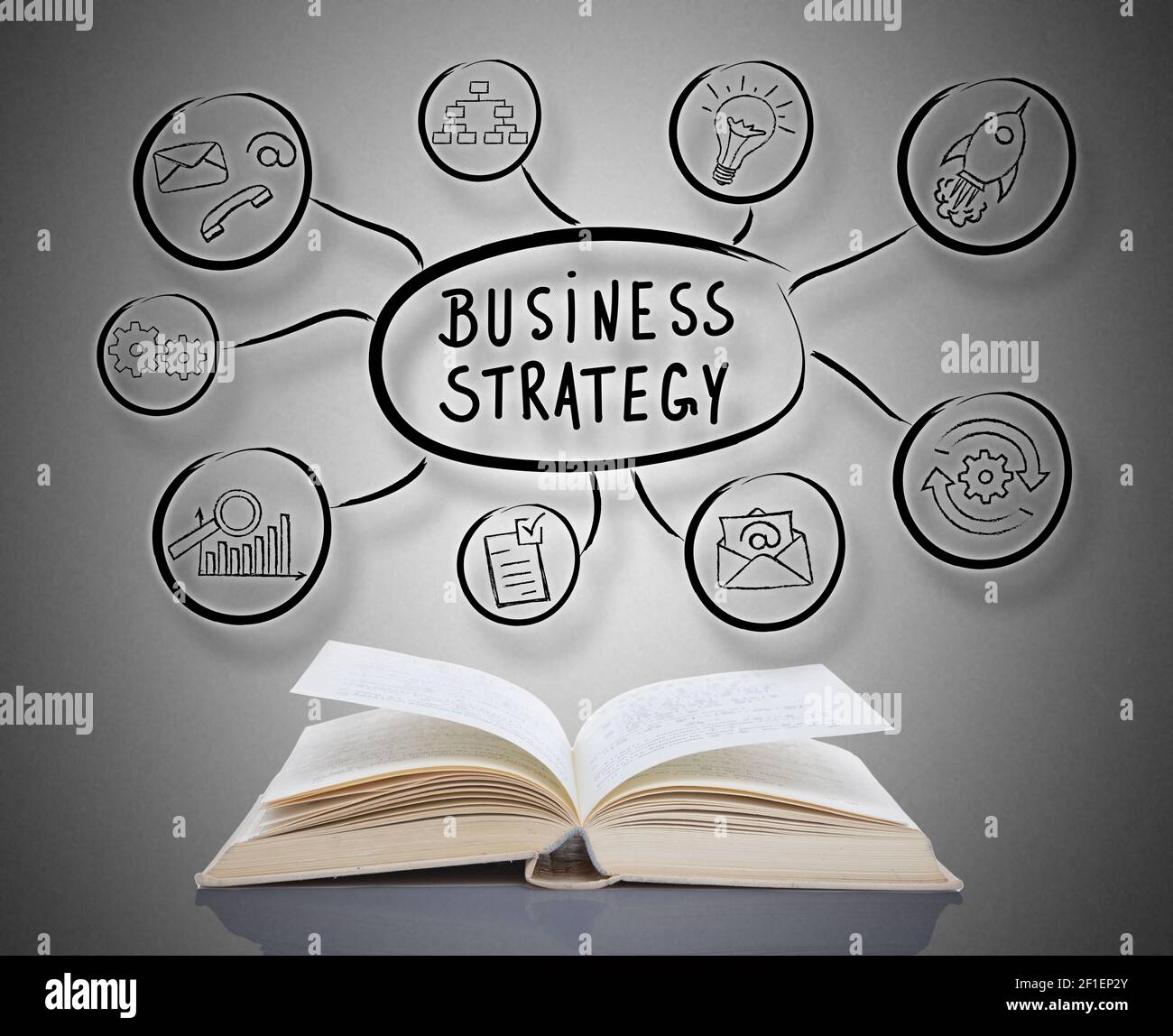Business strategy concept above an open book Stock Photo - Alamy