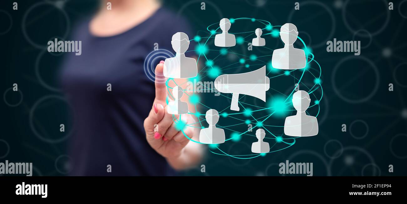 Woman touching a social marketing concept on a touch screen with her ...