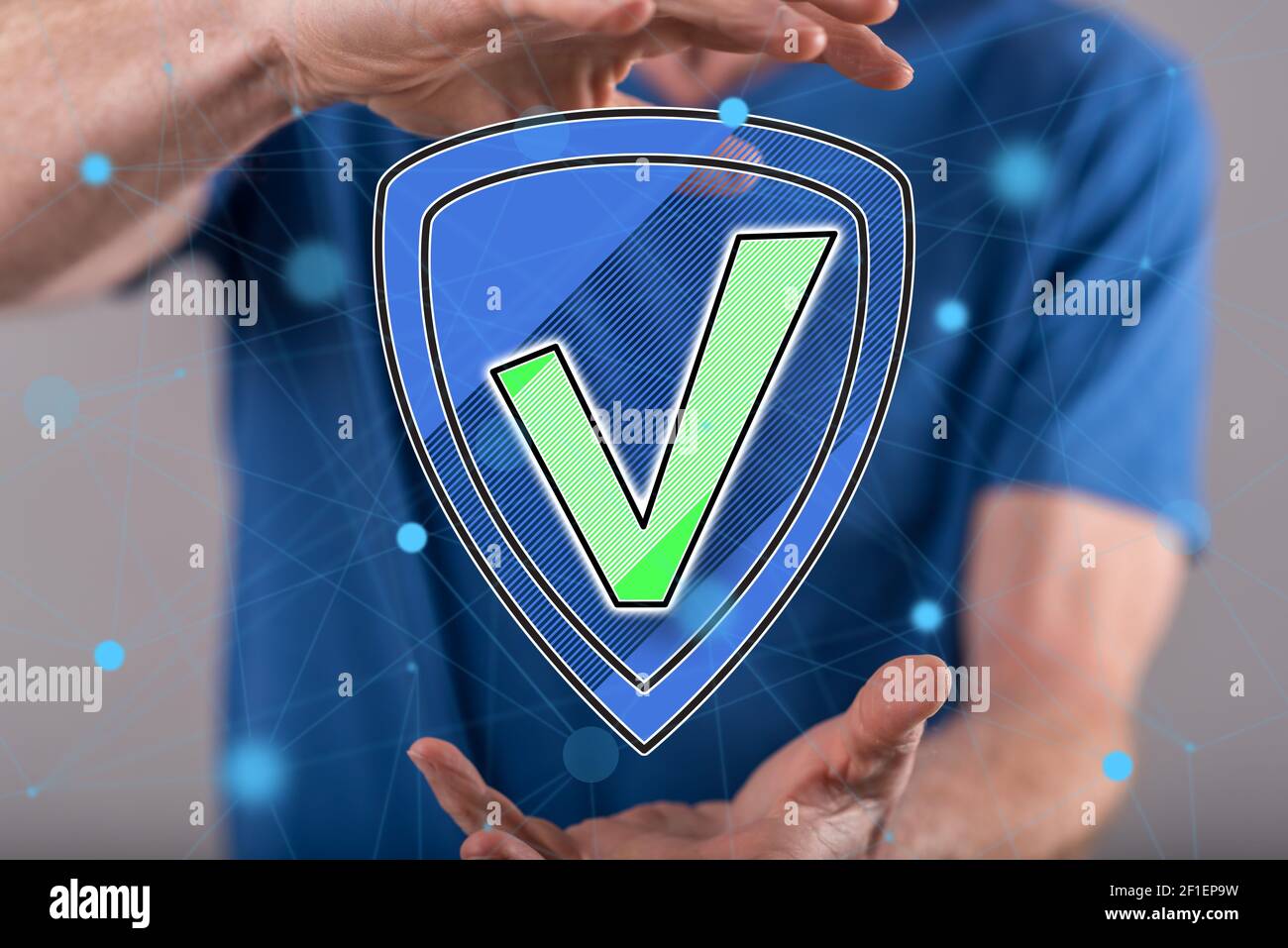 Security approval concept between hands of a man in background Stock ...