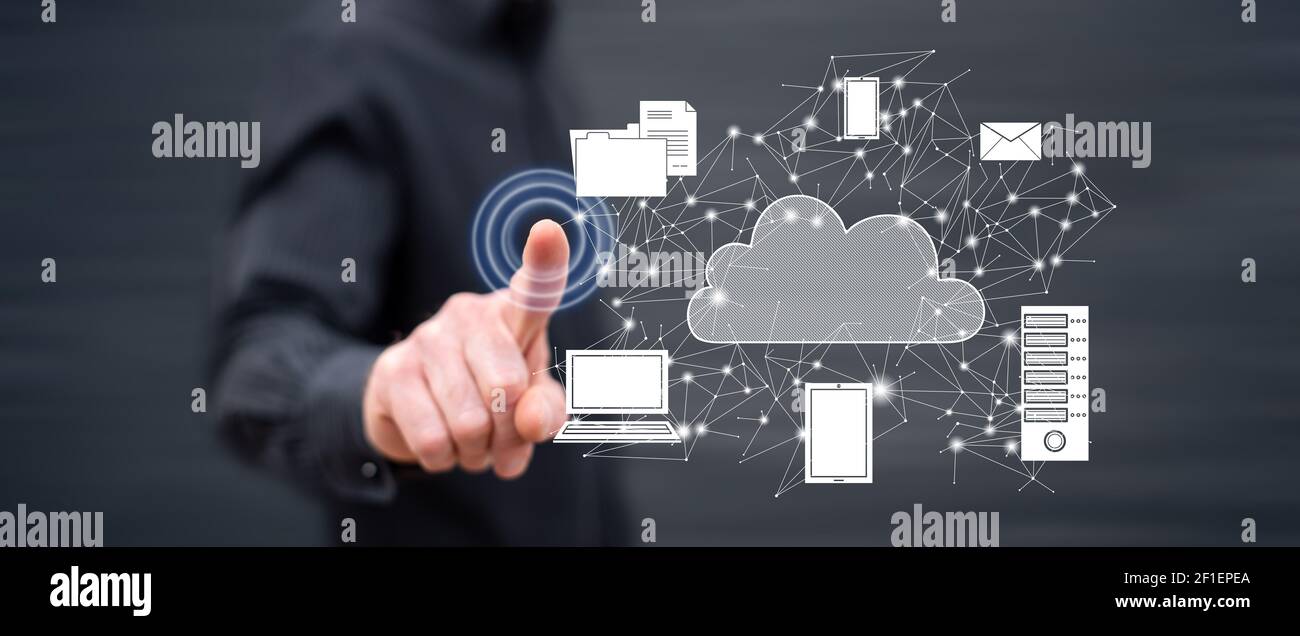 Man touching a cloud computing concept on a touch screen with his ...