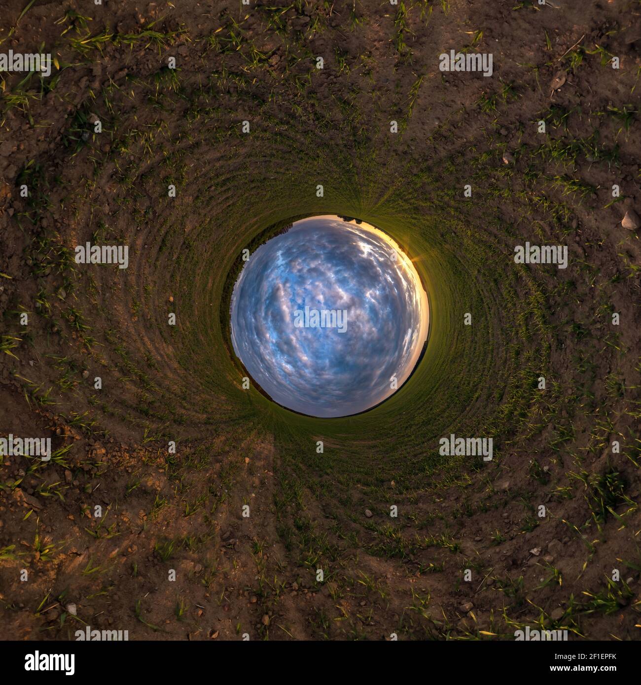 blue sky ball among green grass. Inversion of tiny planet ...