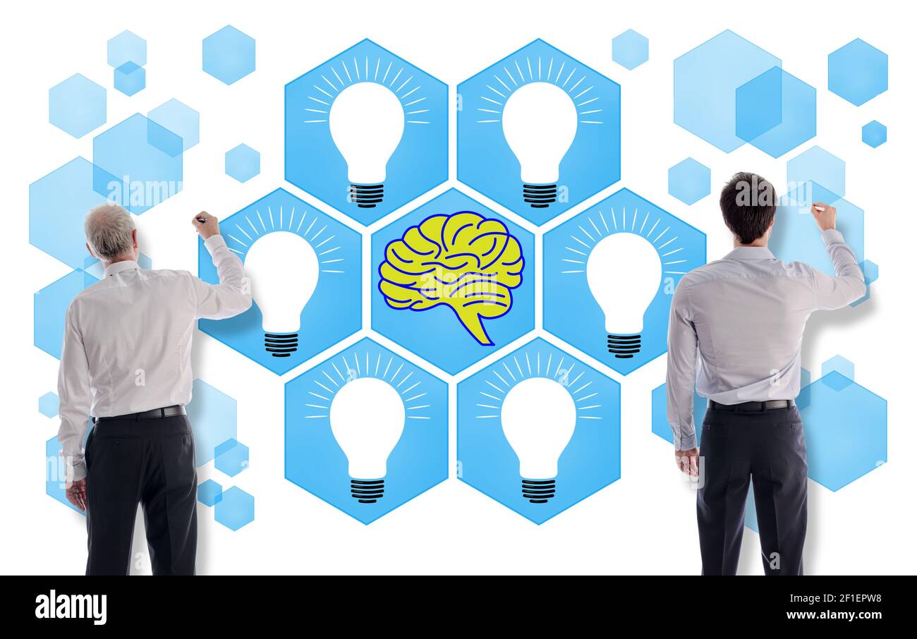 Human brain ideas concept drawn on a white wall by businessmen Stock ...