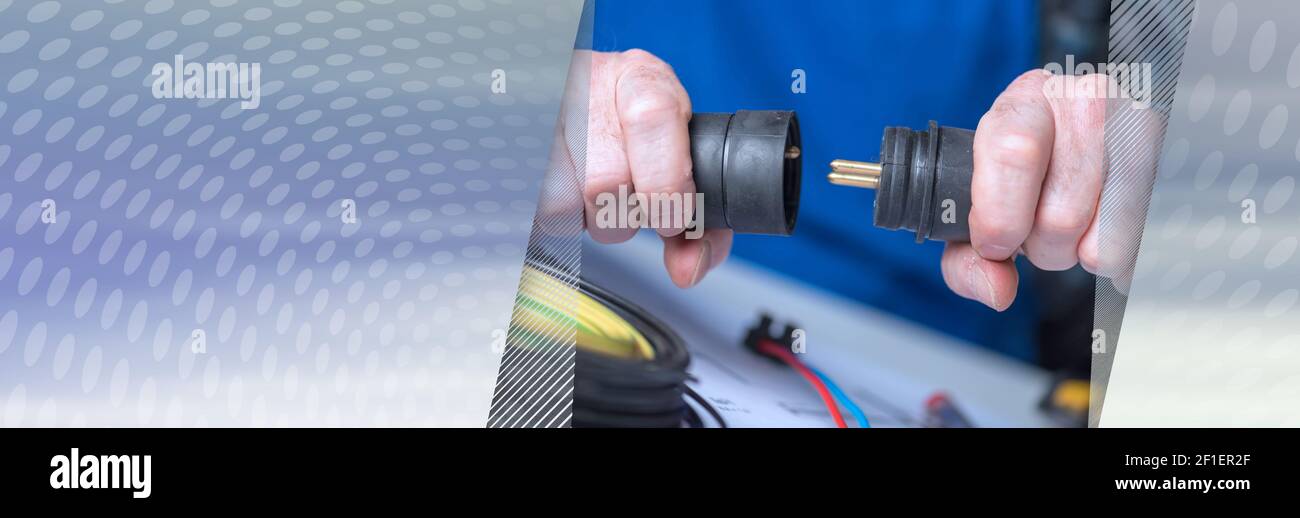 Electrician hands holding electrical plugs. panoramic banner Stock ...
