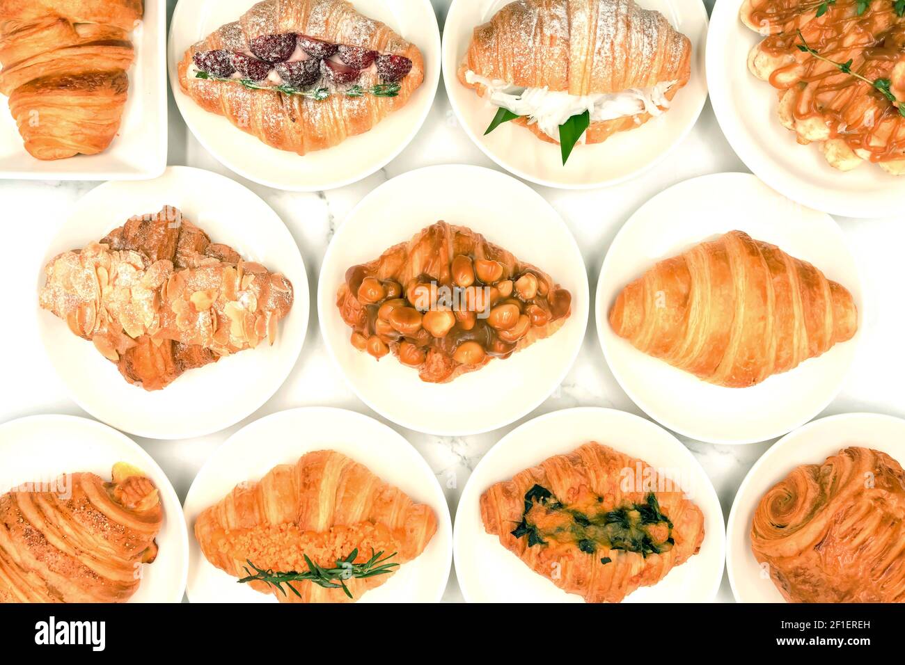 Top view of freshly baked delicious croissants, various types and ...