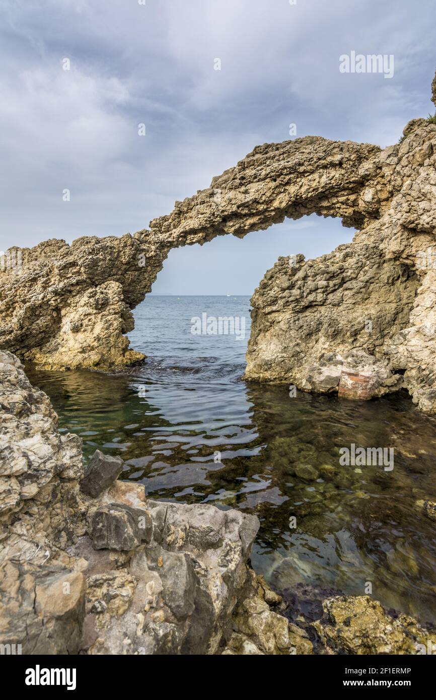 Natural arch over water in Costa Brava, Spain Stock Photo - Alamy