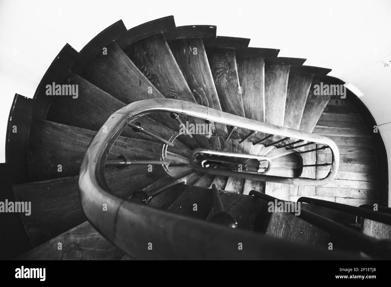 Typical narrow spiral staircase with railing in old Parisian house ...