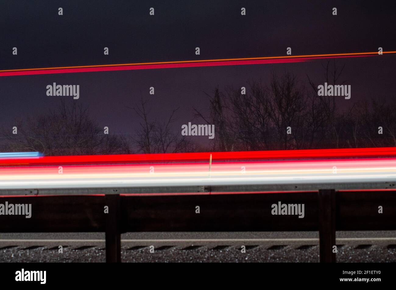 Light trails along a highway at night Stock Photo - Alamy
