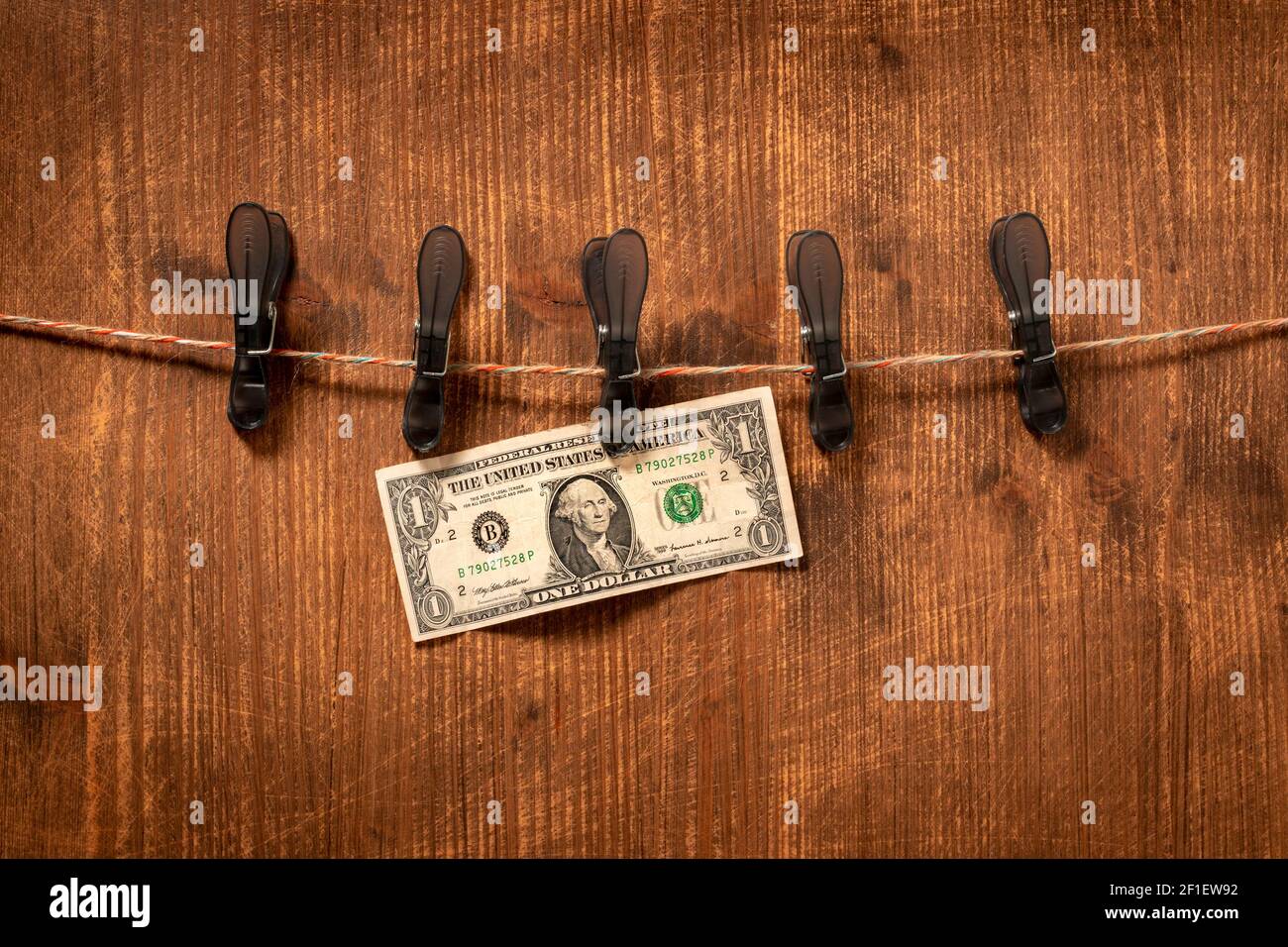 Money laundering concept with banknote of one dollar on the rope Stock ...