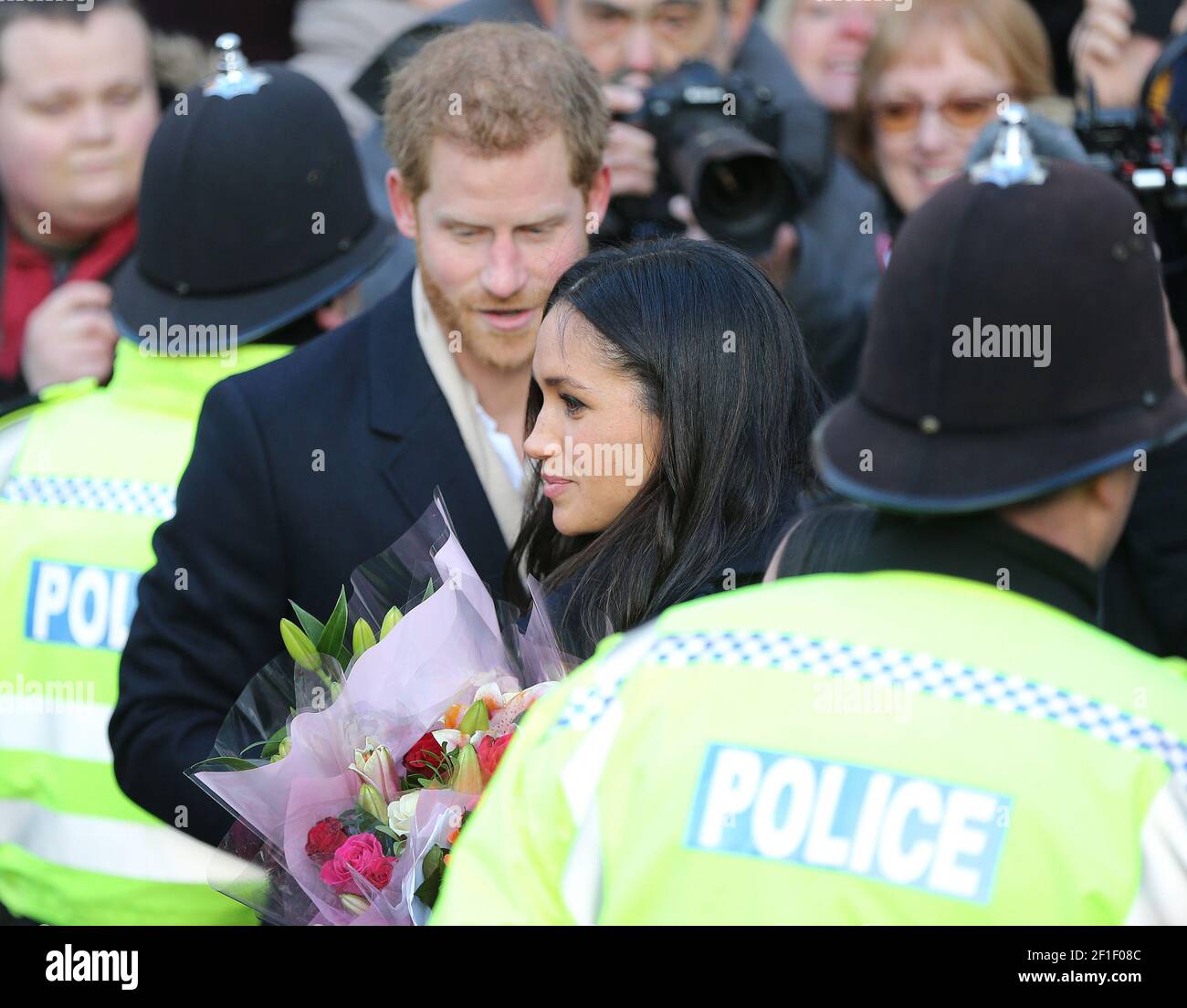 Britain's Prince Harry (L) and US actress Meghan Markle during a visit ...