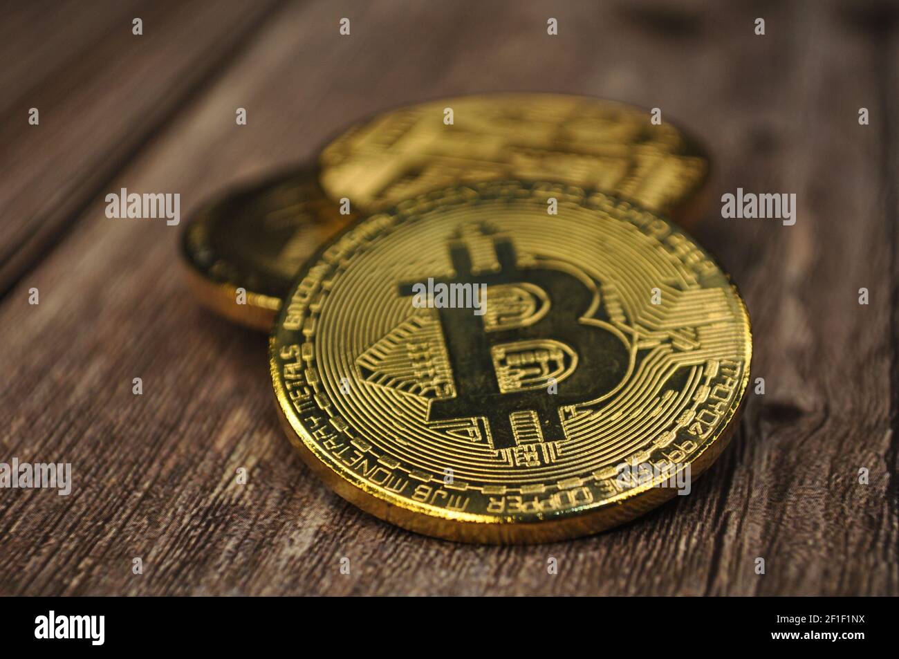 Macro view of gold and silver color shiny coins with Bitcoin symbol ...