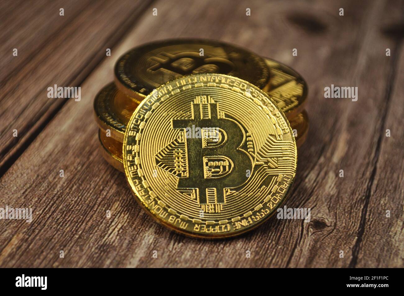 Macro view of gold and silver color shiny coins with Bitcoin symbol ...