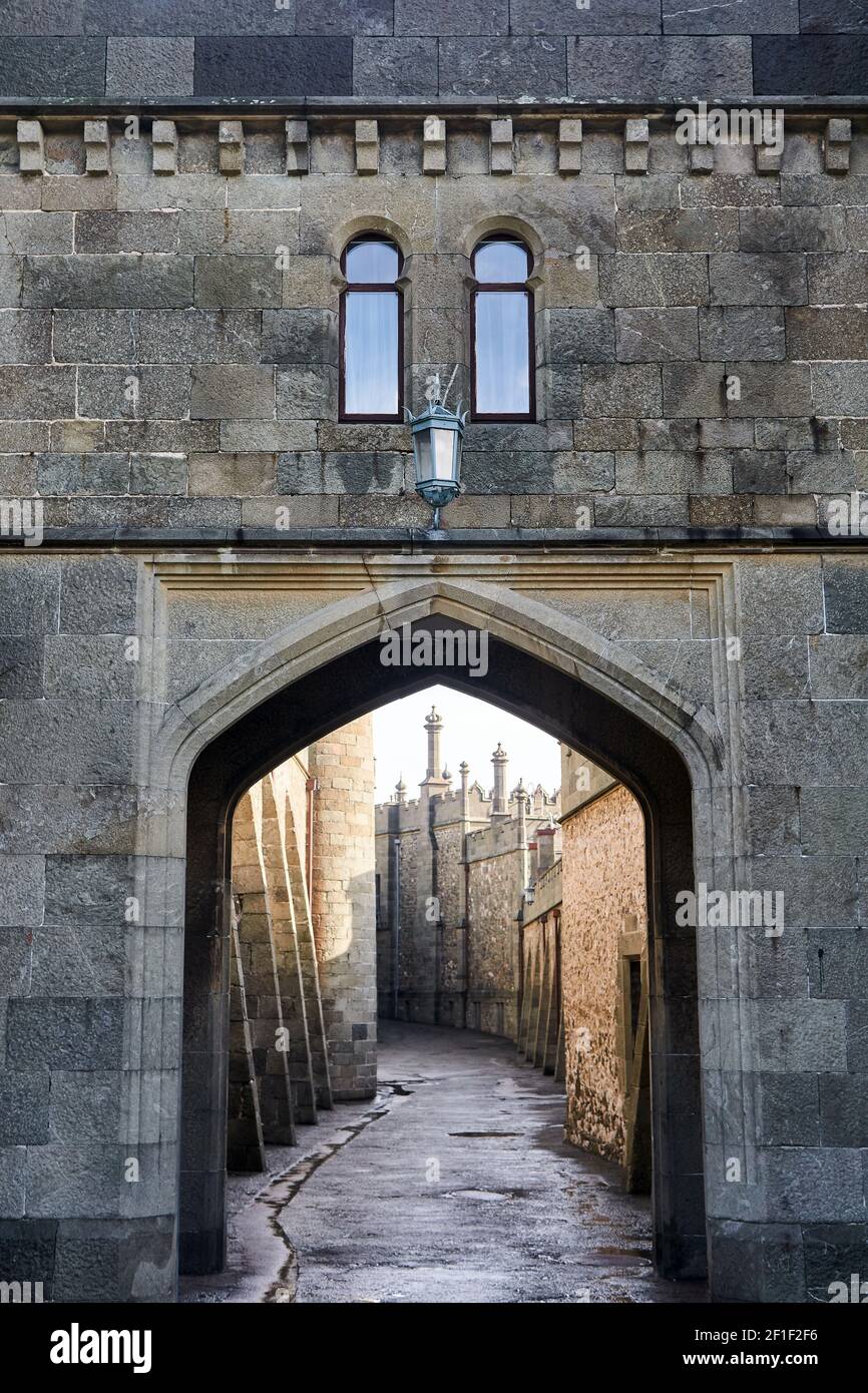 fragment of a wall with arch and tower of the 19th century palace in ...
