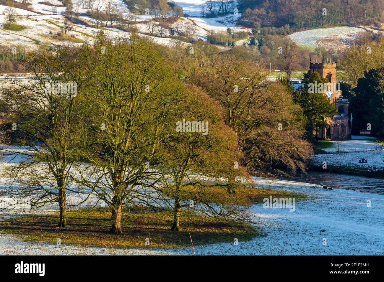 Snow covered landscape with trees at Cromford near Matlock Bath in the ...