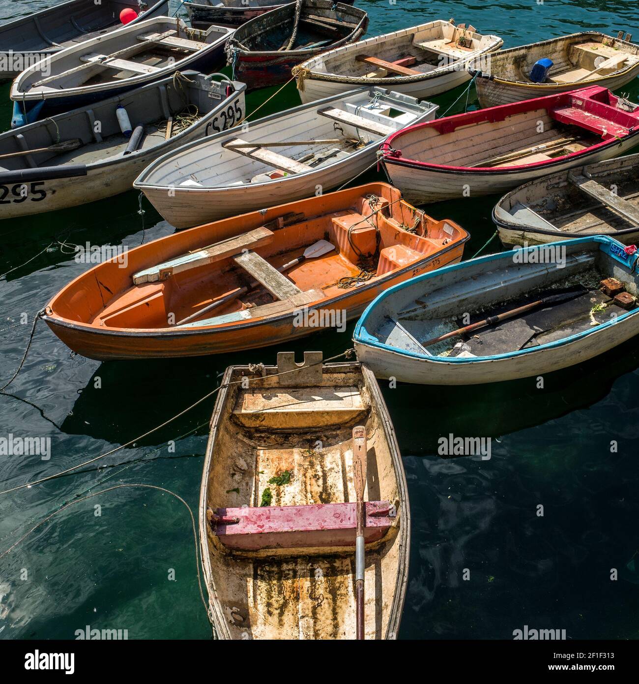 wooden, rowing ,boats ,tethered, together , in harbour, Cornwall UK ...