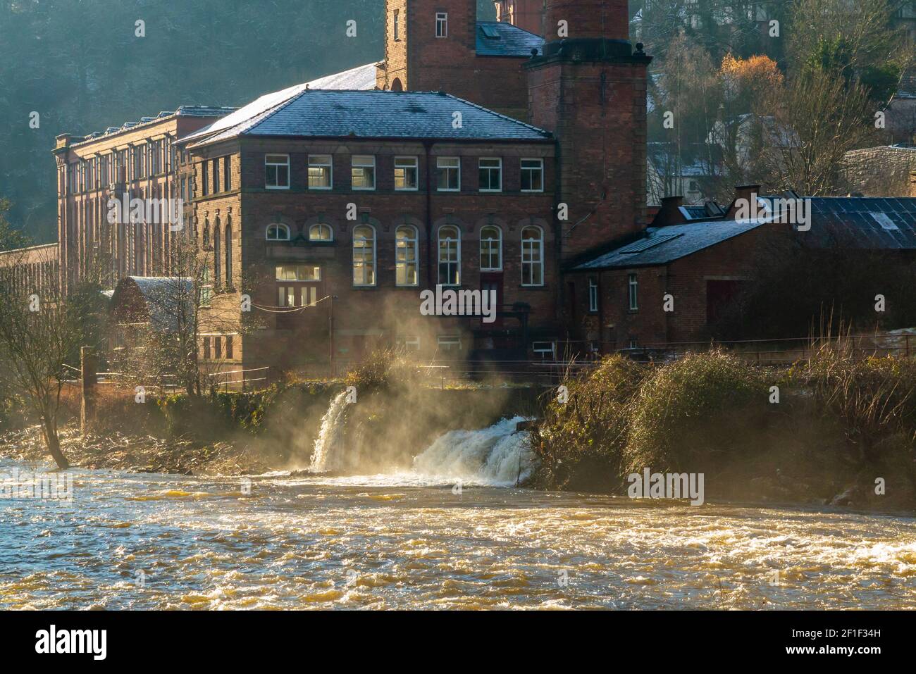 Winter view of Masson Mill and River Derwent at Matlock Bath a hillside ...