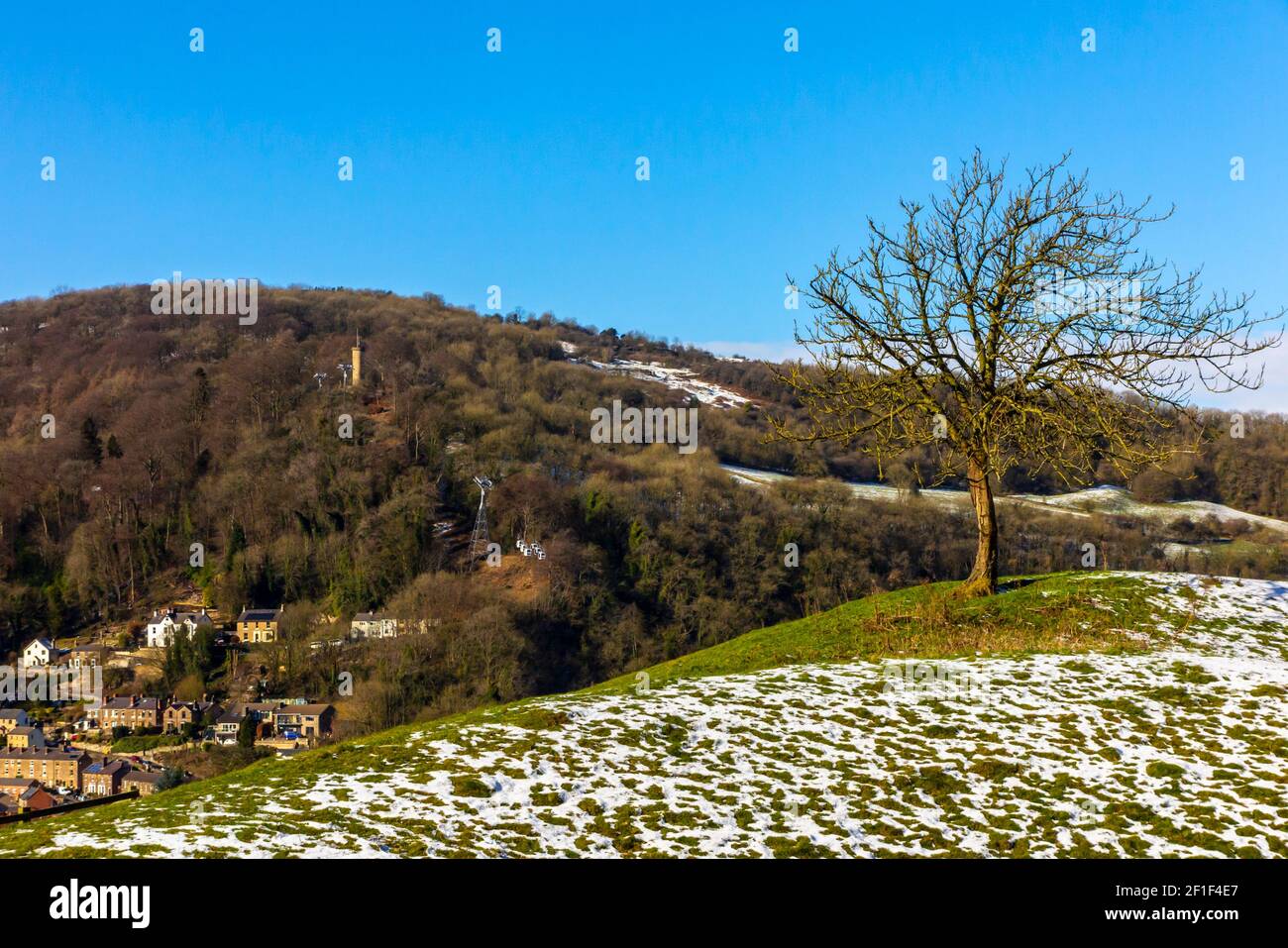 Snow covered landscape with trees at Starkholmes near Matlock Bath in ...