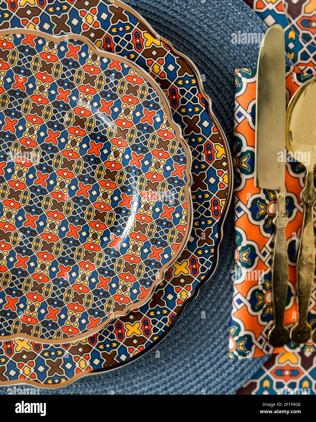 A vertical shot of a colorful textured plate in a beautiful set Stock ...