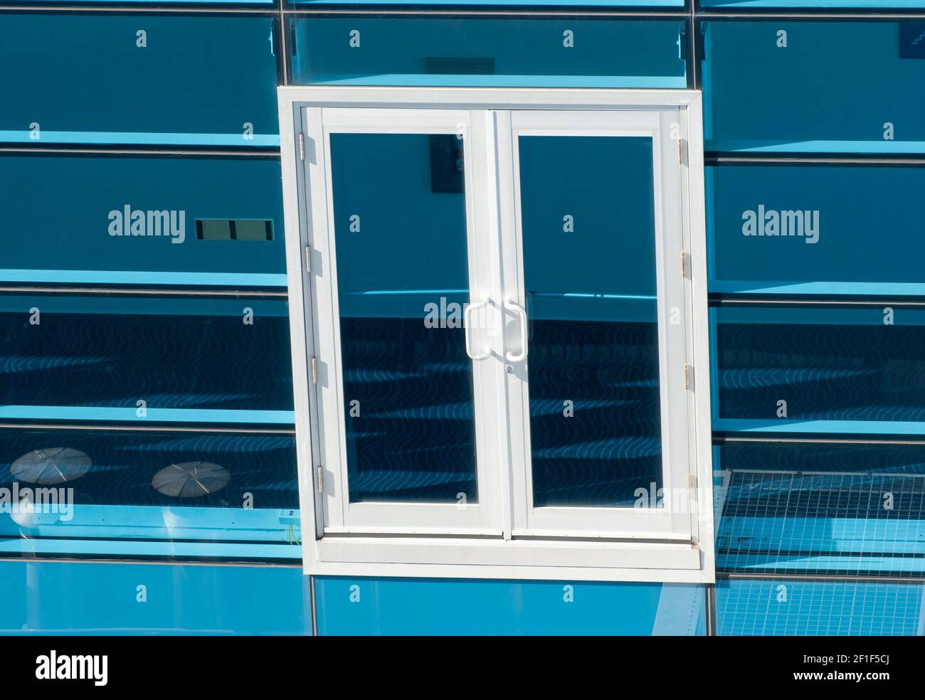 The abstract view of Miami cruise ship terminal door that connects a ...