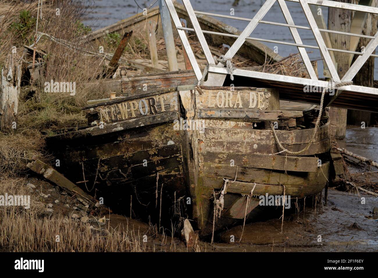 A wrecked wooden old boat tied to the bridge Stock Photo - Alamy