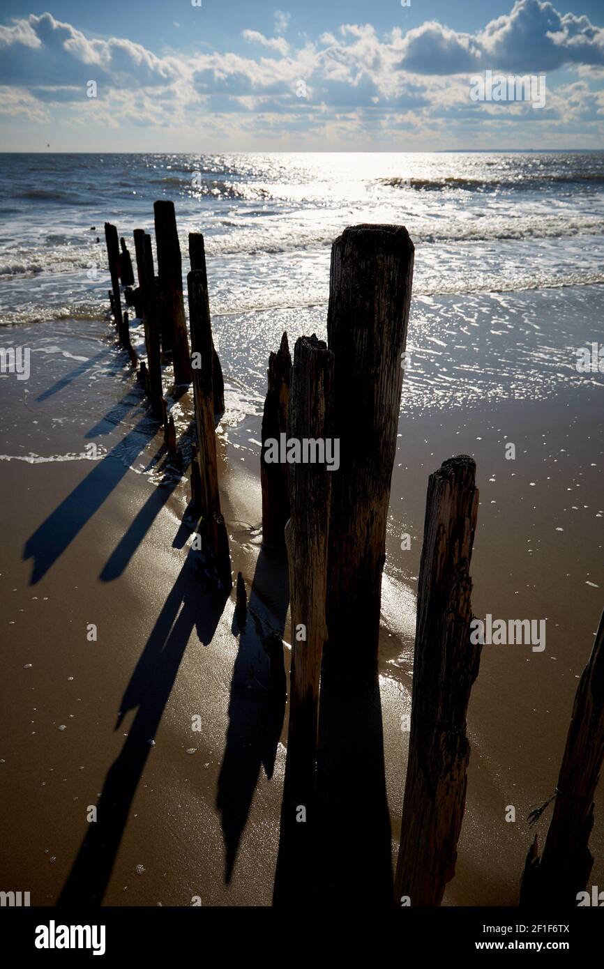 Wooden posts shore sky sunset beach hi-res stock photography and images ...