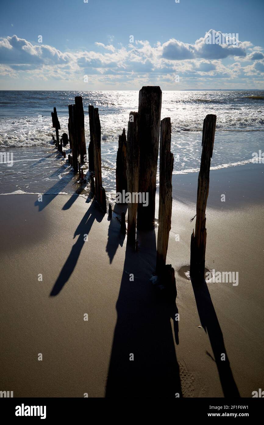 Wooden posts shore sky sunset beach hi-res stock photography and images ...
