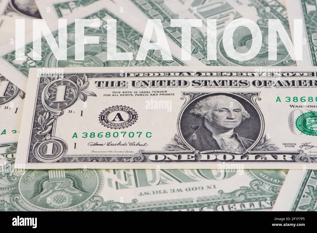 the word Inflation written in white capital letters over a photo of one ...
