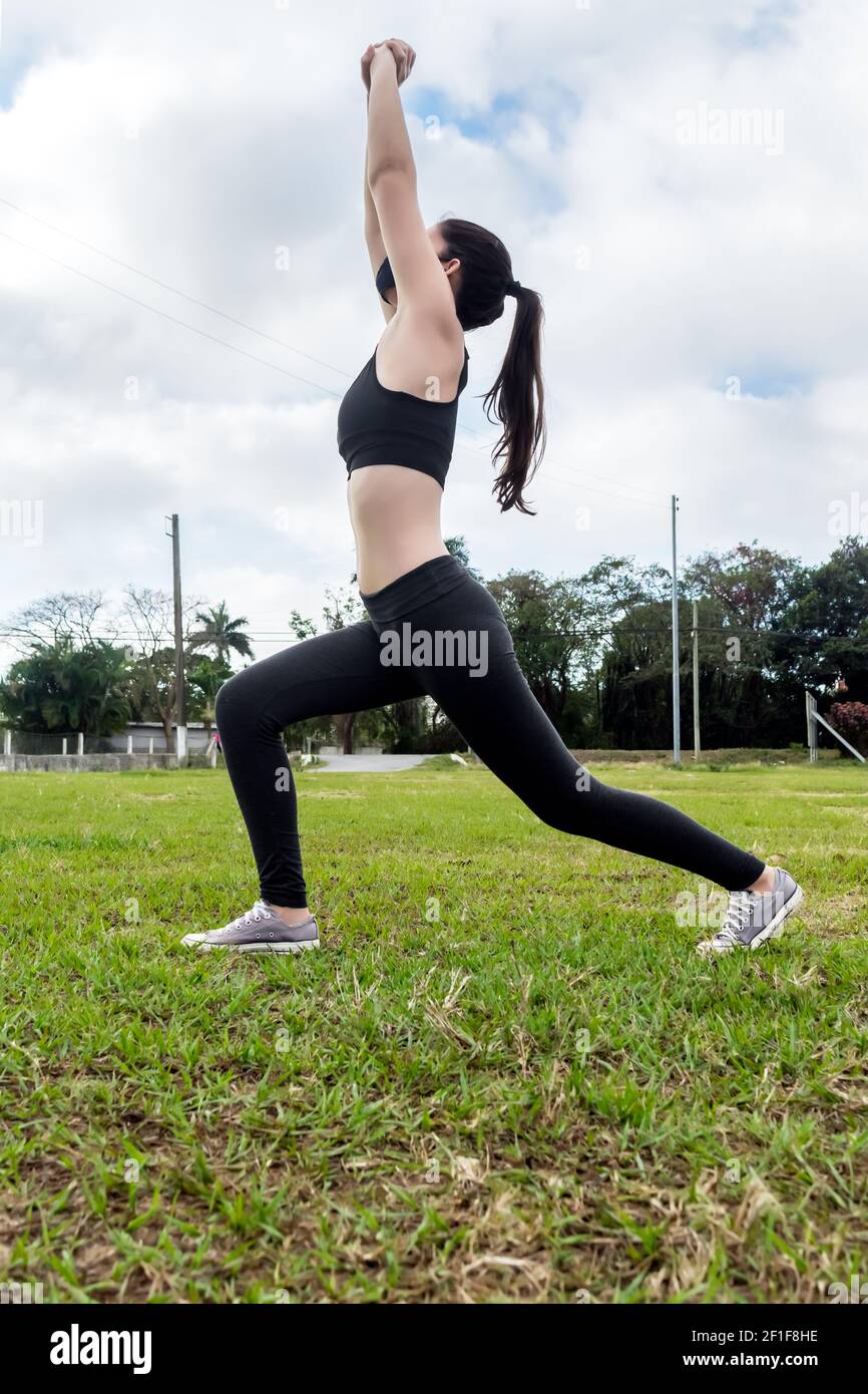 Woman with arms lifted hi-res stock photography and images - Alamy