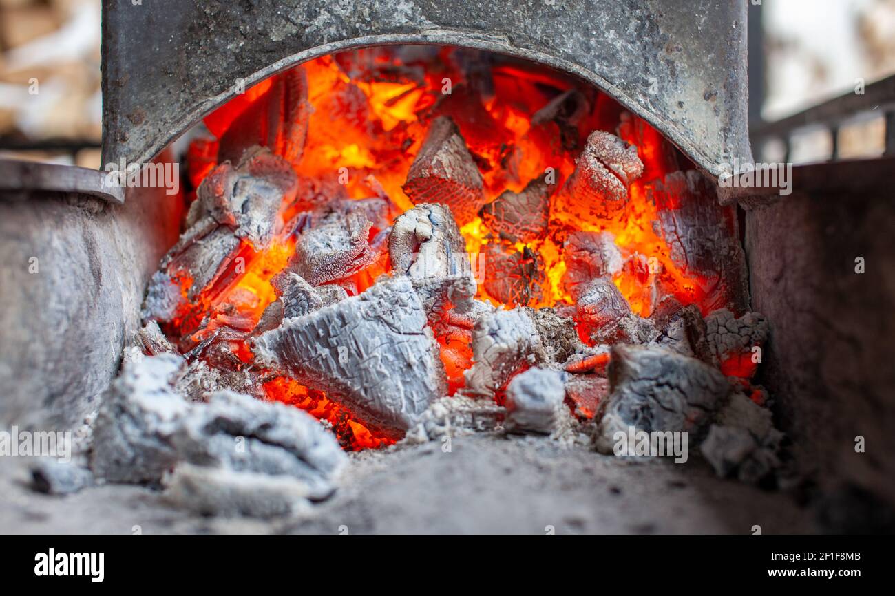 Burning coals in a metal grill for frying meat and vegetables. Cooking ...