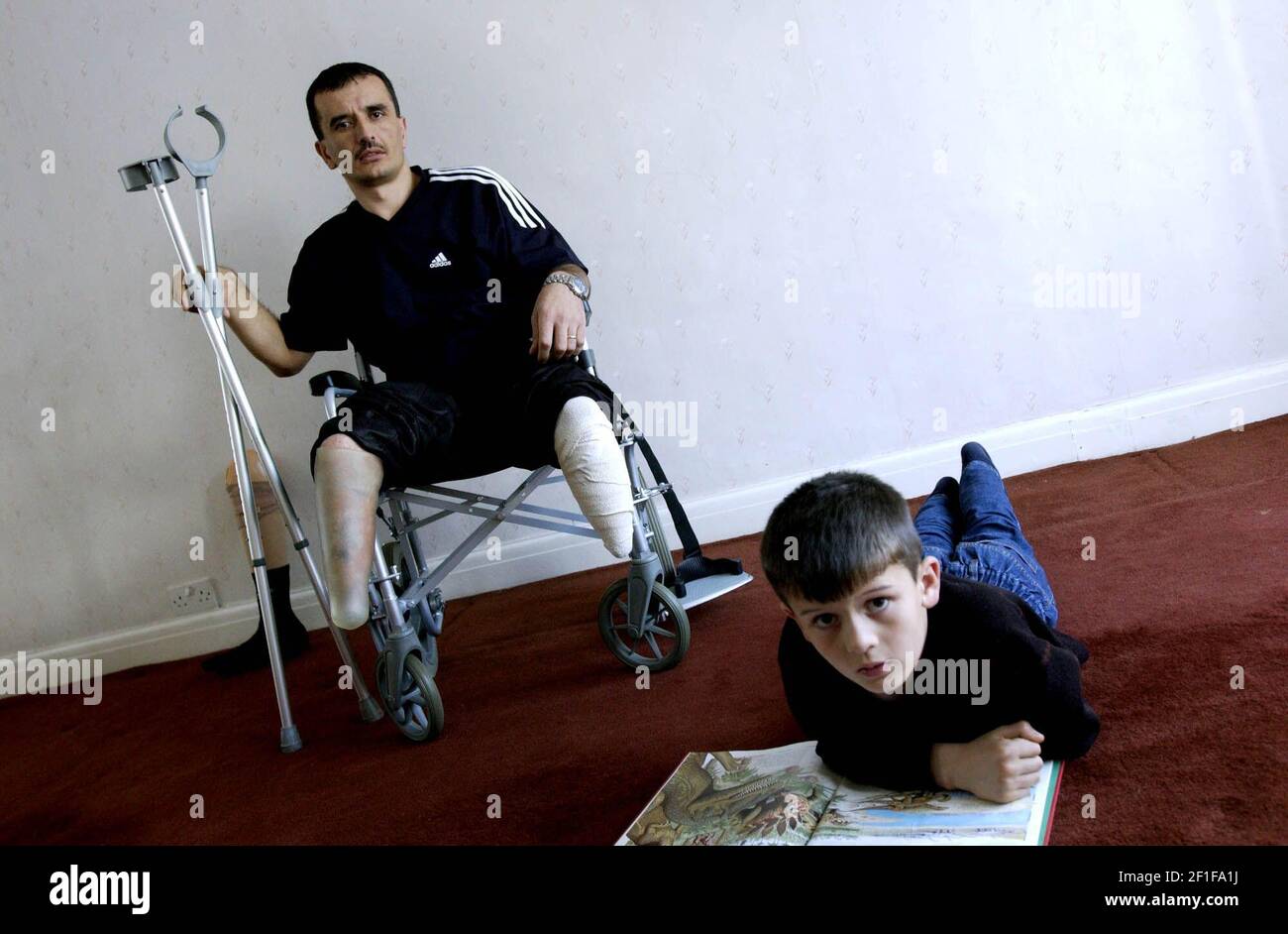 Mr Kujtim Morina with his one of his four children Kimet. The family ...