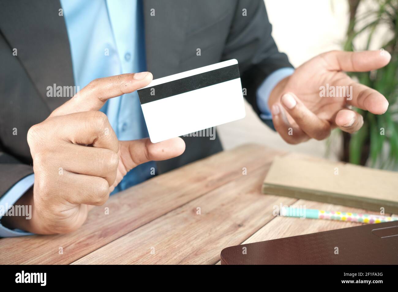 young man hand showing credit card and frustration Stock Photo - Alamy