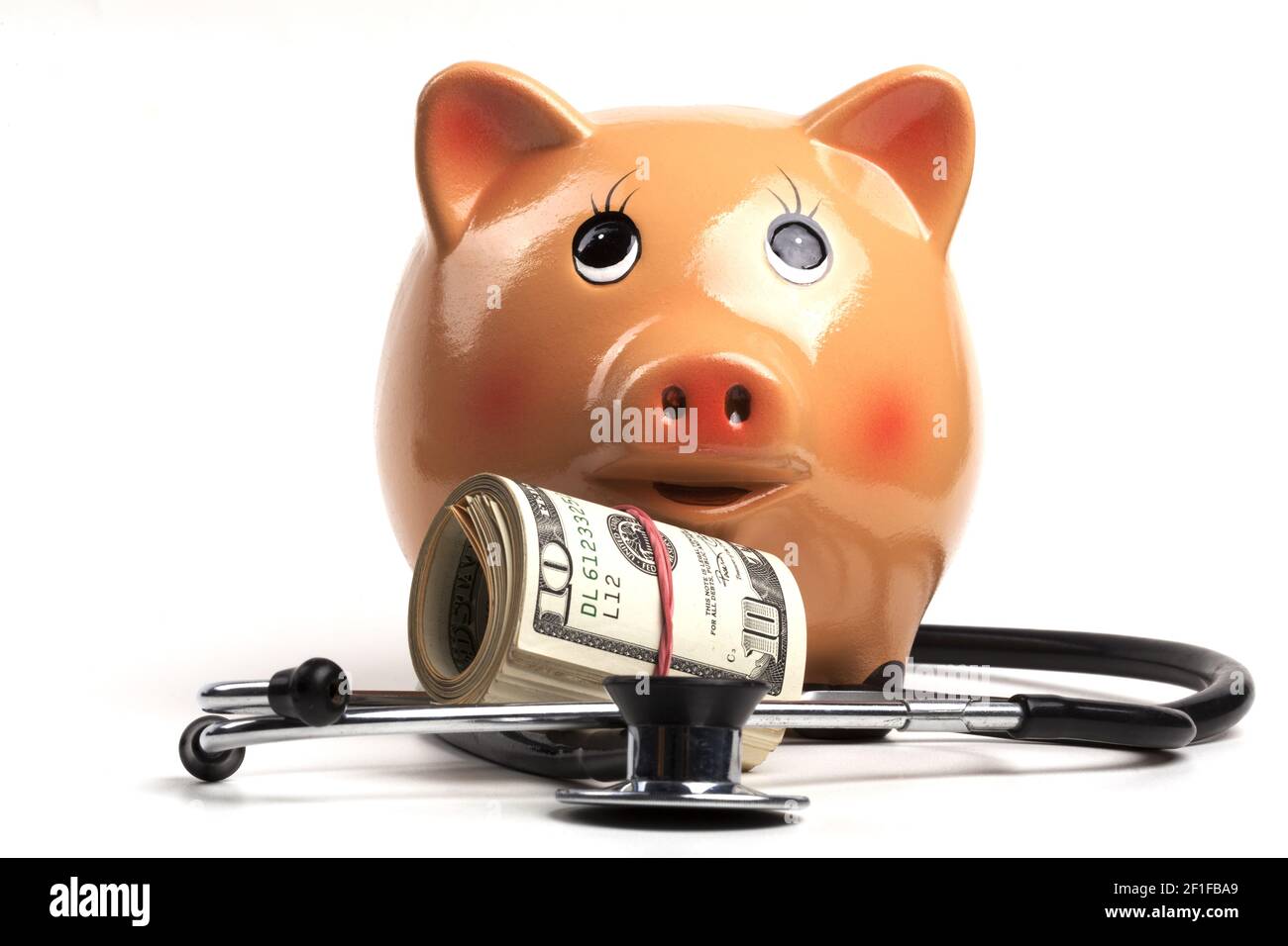 Piggy Doctor and Dollars Stock Photo - Alamy