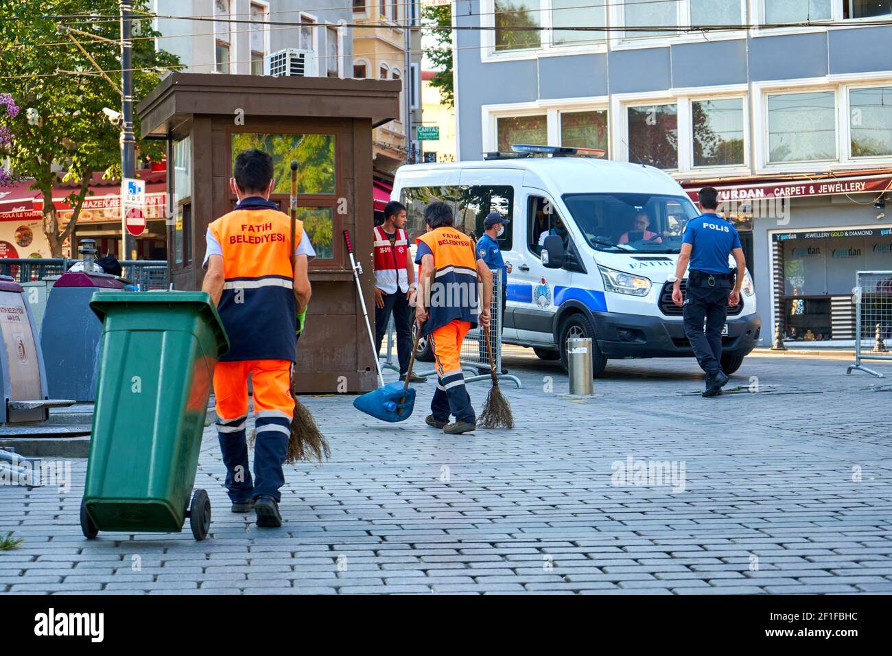 Walking tour of istanbul. Wipers sweeping the street. A police van ...