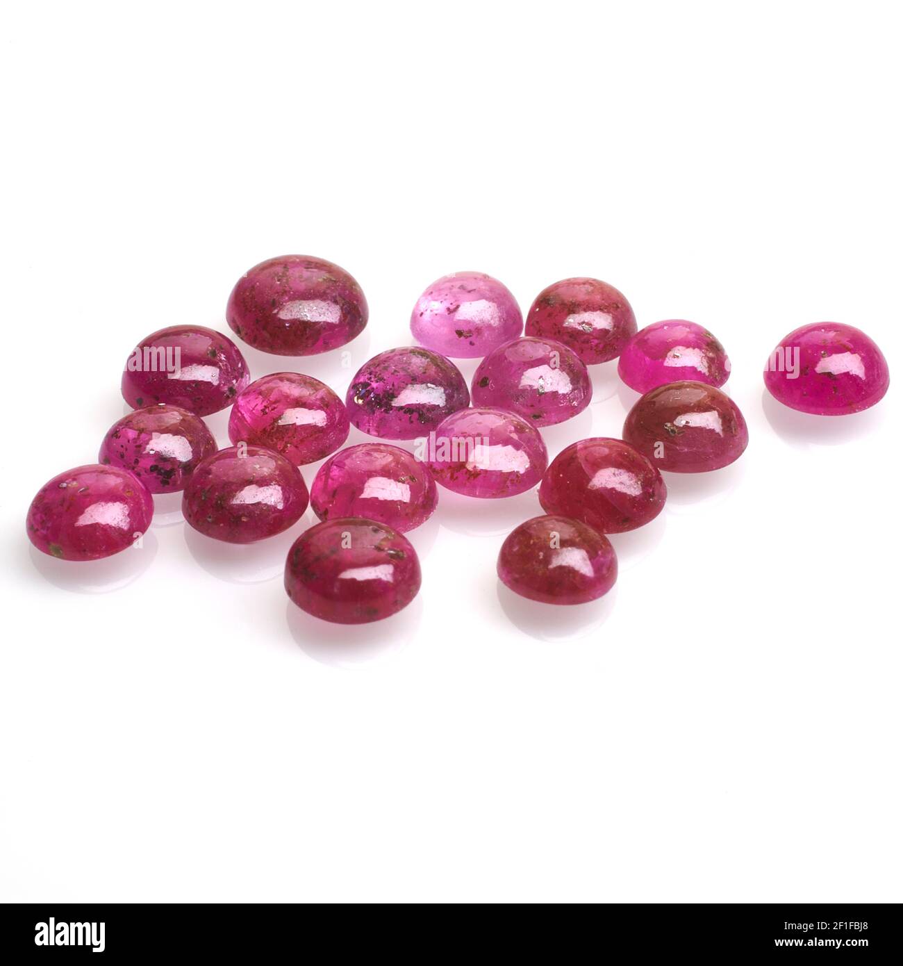 Ruby cabochons on a white background, Not Cut Out Stock Photo - Alamy