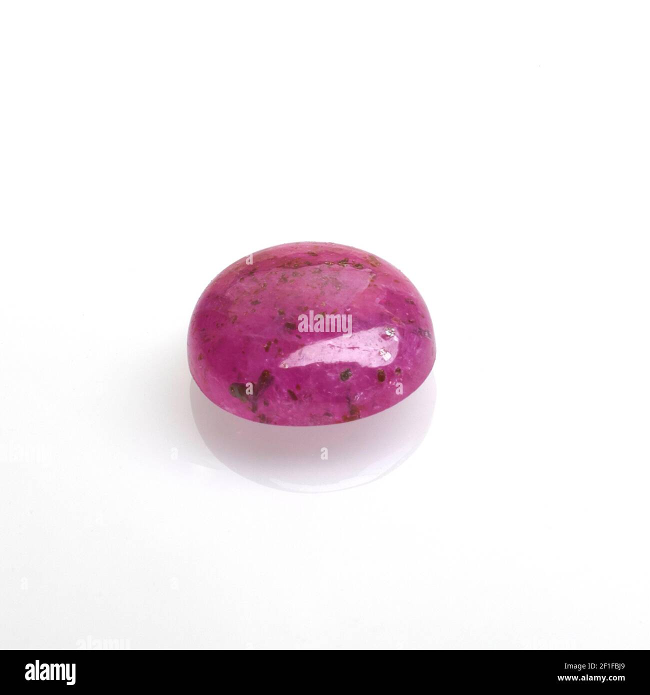 Ruby cabochons on a white background, Not Cut Out Stock Photo - Alamy