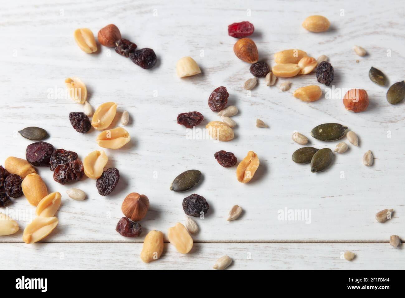 set of dried fruits with wood background Stock Photo - Alamy