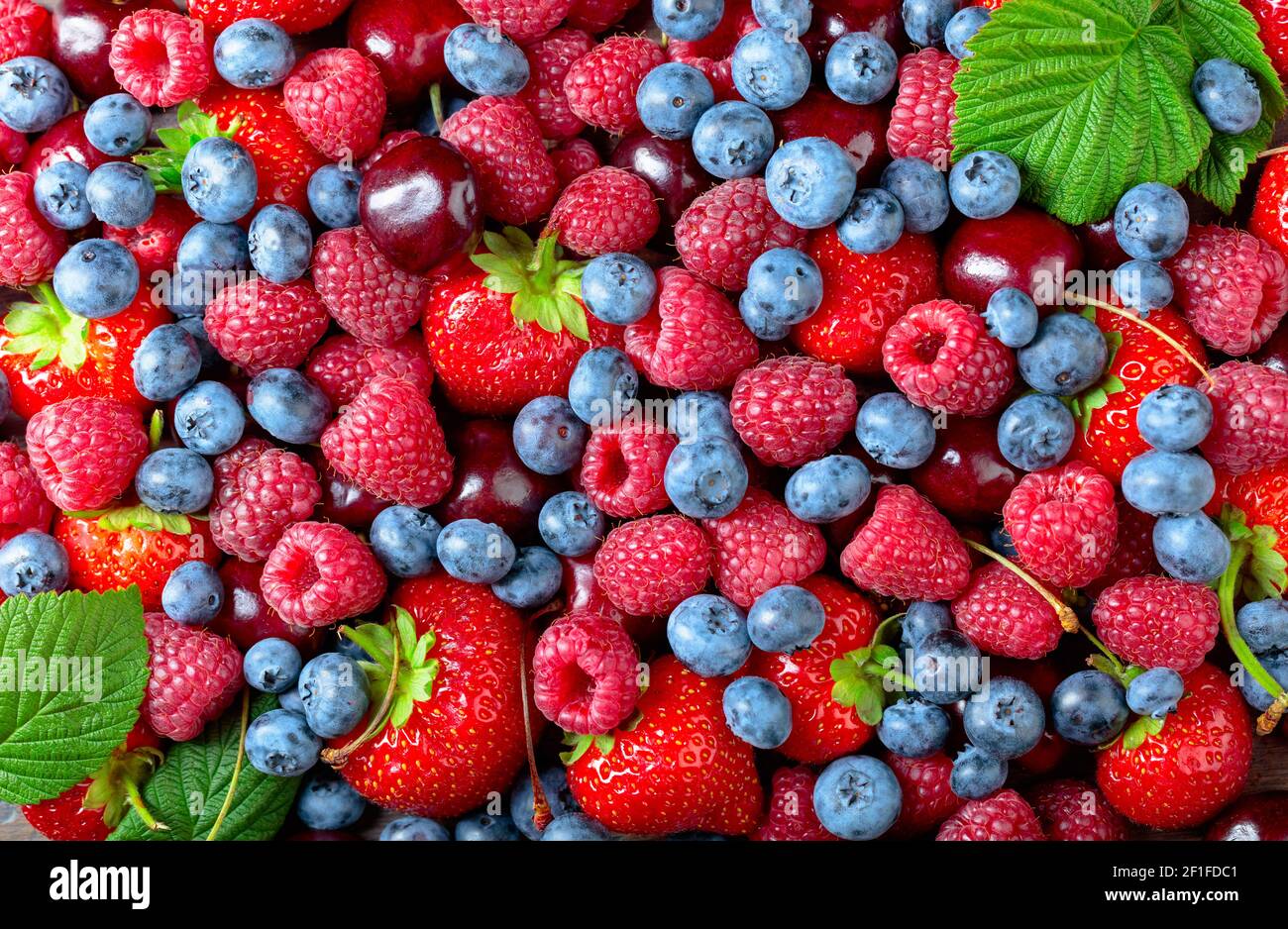 Berries closeup colorful assorted mix of strawberry, blueberry ...