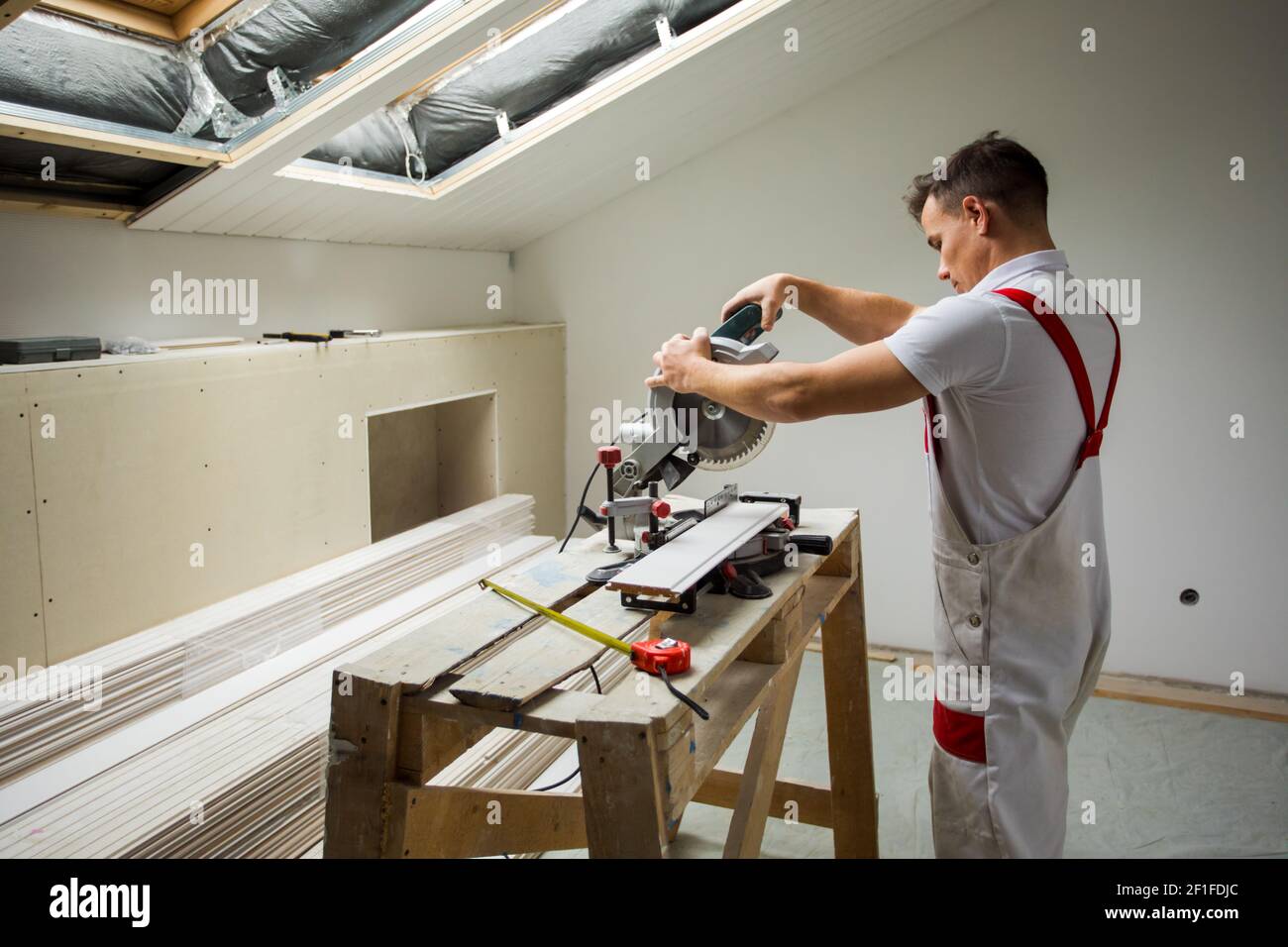 the master works with a special tool is processing boards Stock Photo ...