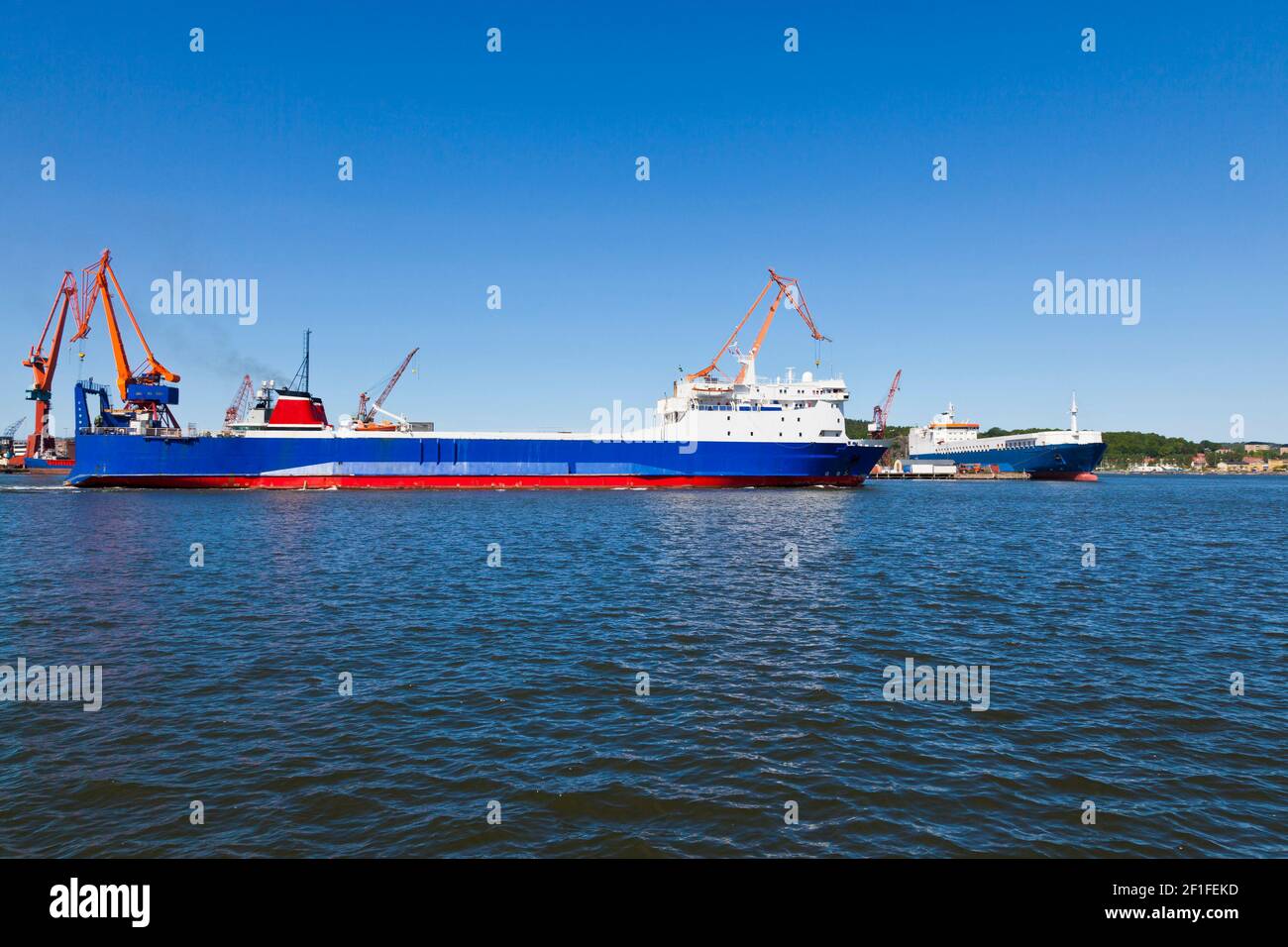 Ship entering the port for loading Stock Photo - Alamy