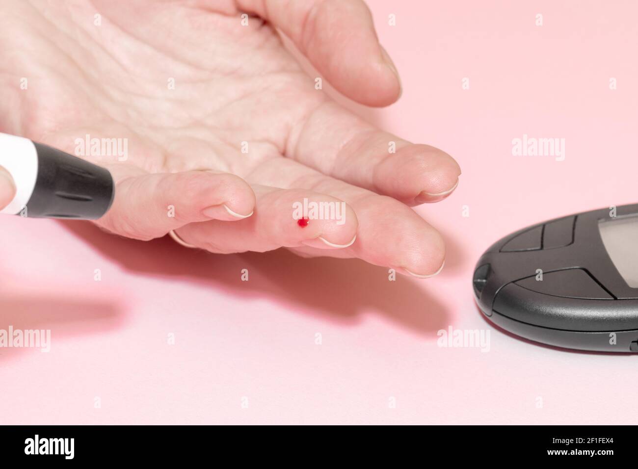 Health care concept. Close-up view of woman fingers doing blood test ...