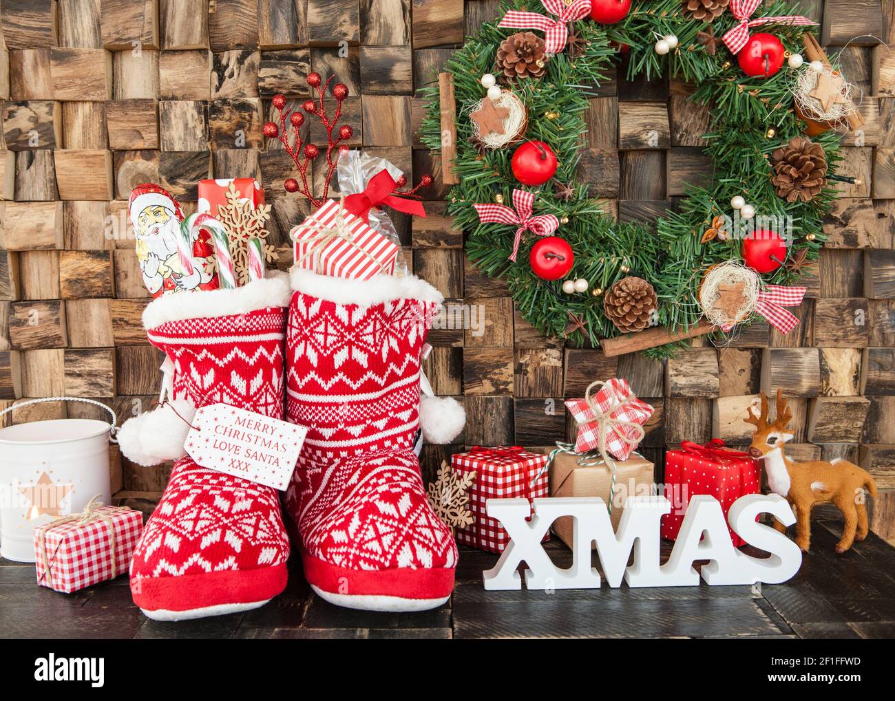 Small boots with gifts Stock Photo - Alamy