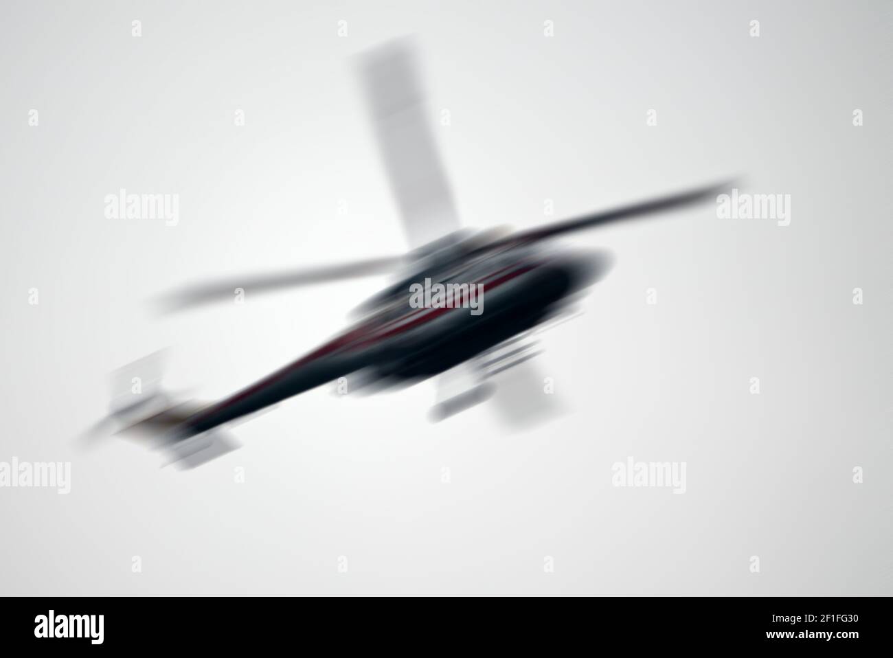 Rescue helicopter with a lowered ramp (safety ladder). Blurred ...