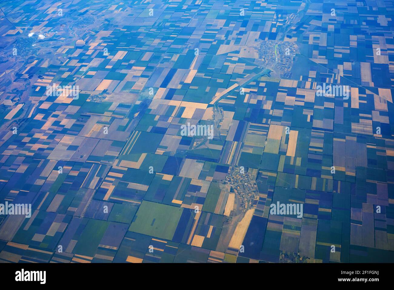 Daytime view from a flying plane over fields and land shares Stock ...