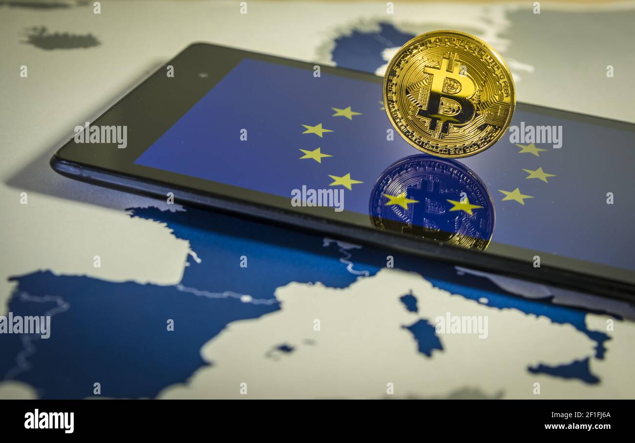 Financial concept with golden Bitcoin over smartphone, EU flag and map ...